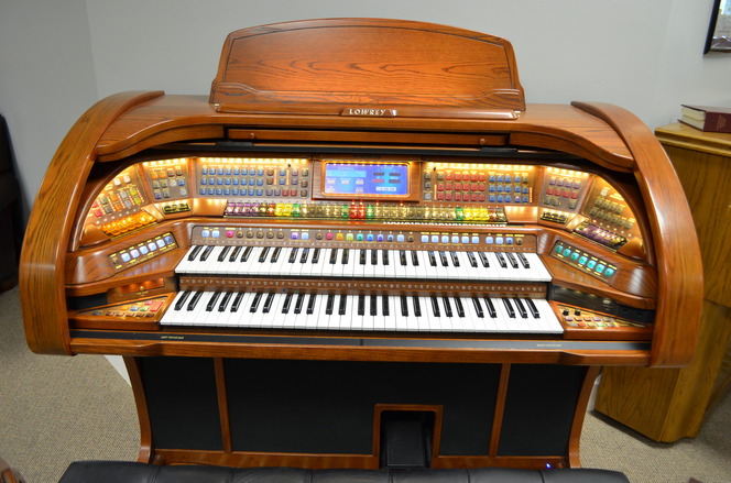 Lowrey Imperial organ, warm oak cabinet