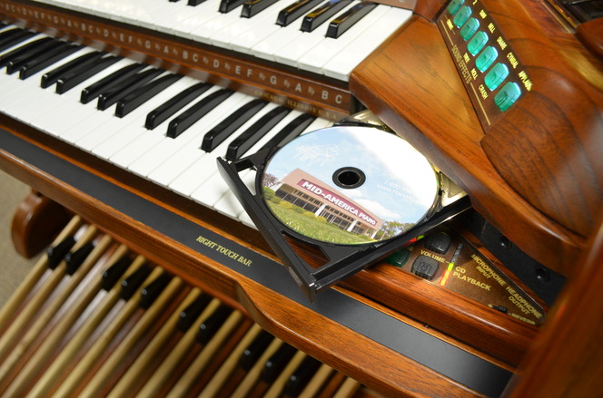 Lowrey Imperial organ, warm oak cabinet